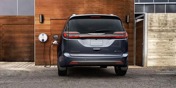 A back view of a 2024 Chrysler Pacifica Plug-In Hybrid (PHEV) parked ...